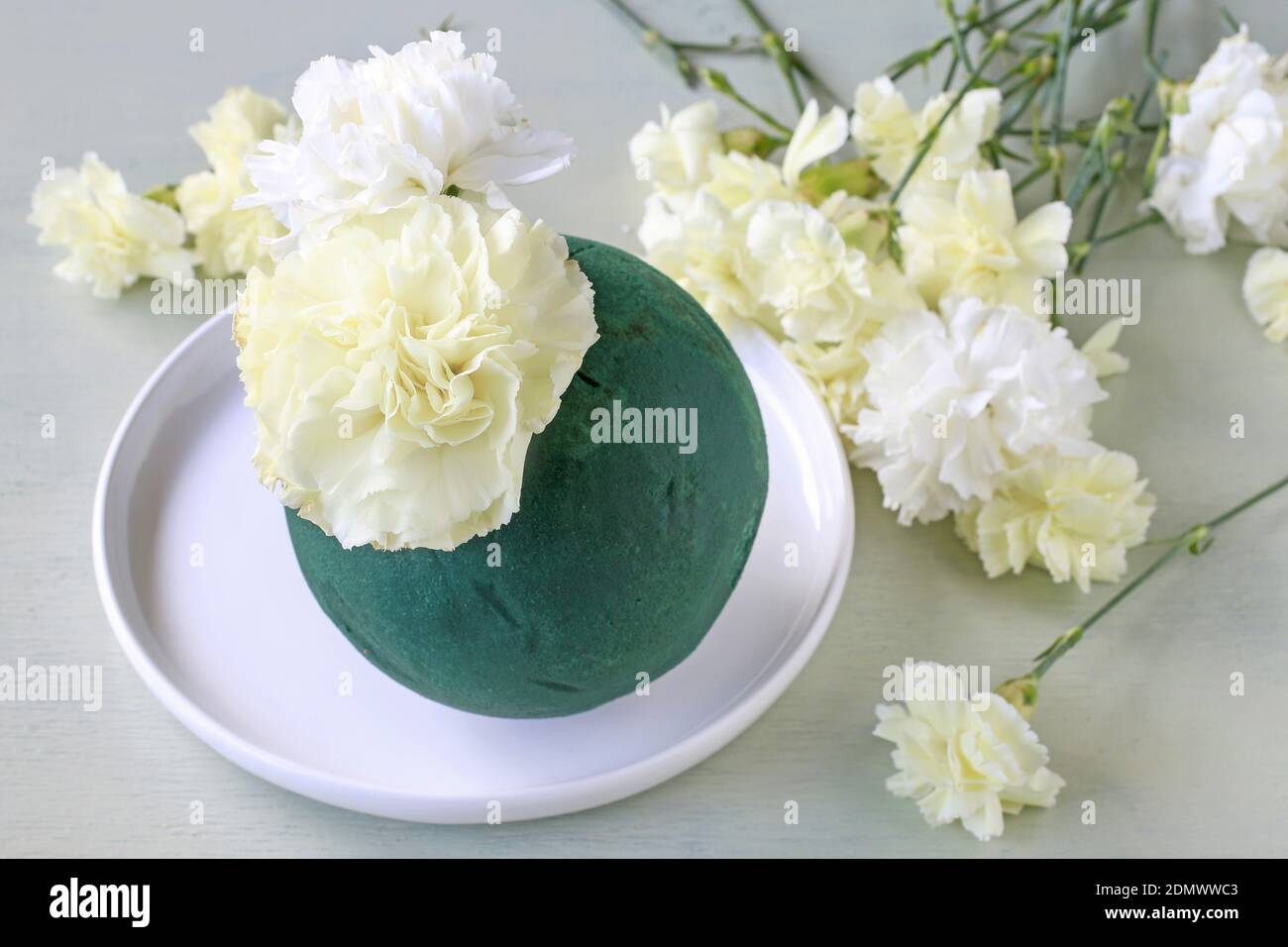 Florist at work: How to make carnation pomander ball, popular wedding decoration. Step by step ...