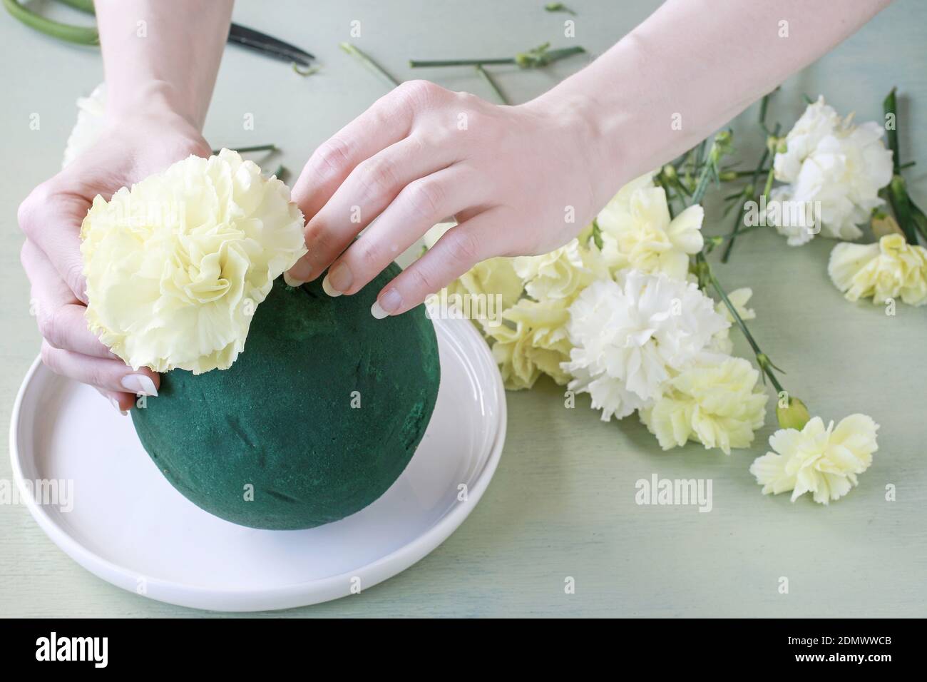 Florist at work: How to make carnation pomander ball, popular wedding decoration. Step by step ...