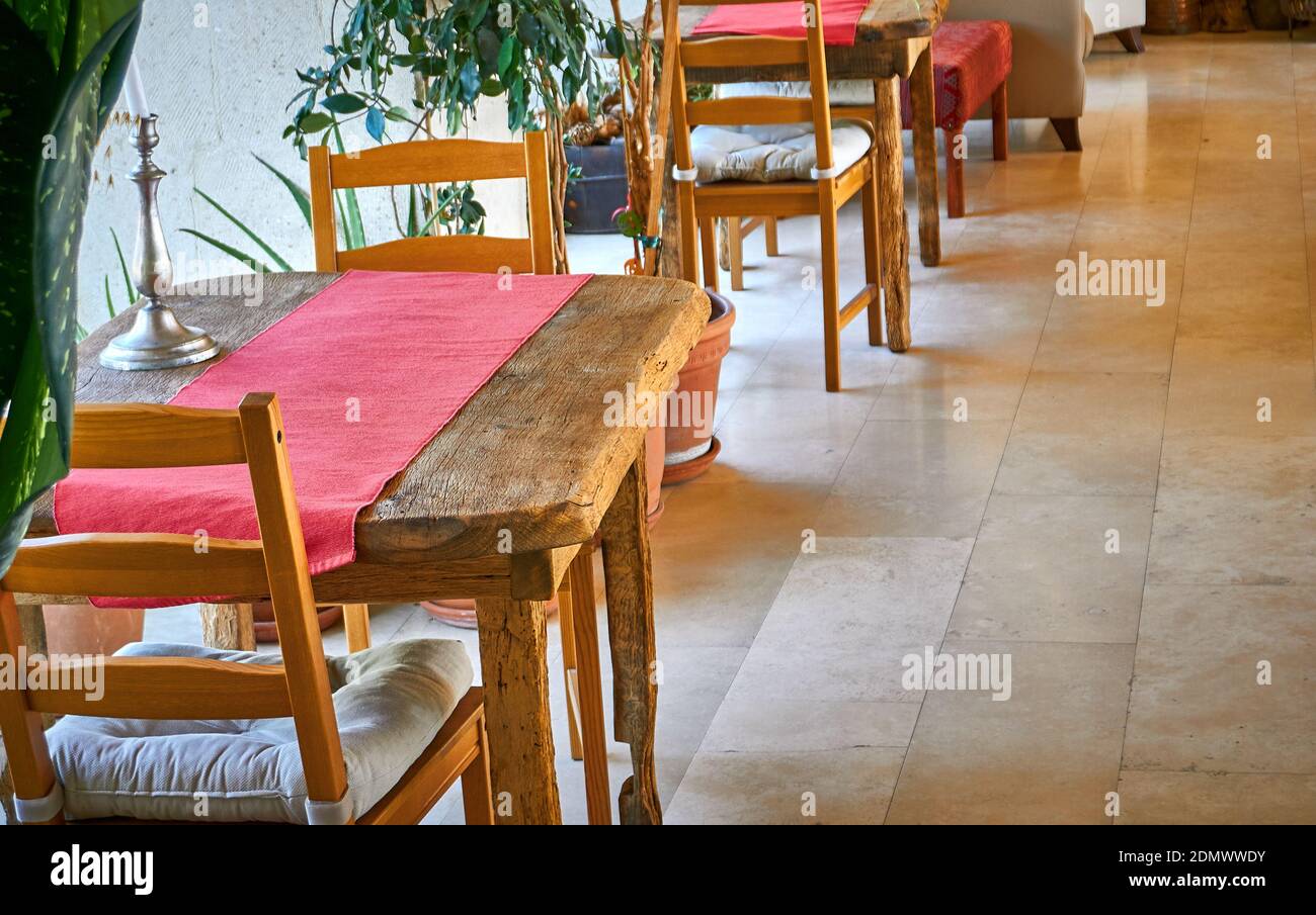 Beautiful interior decoration with wooden tables and chairs Stock Photo ...