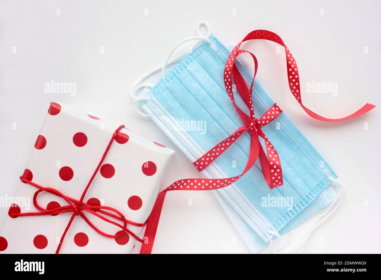 Disposable face masks and gift box on white background with copy space ...