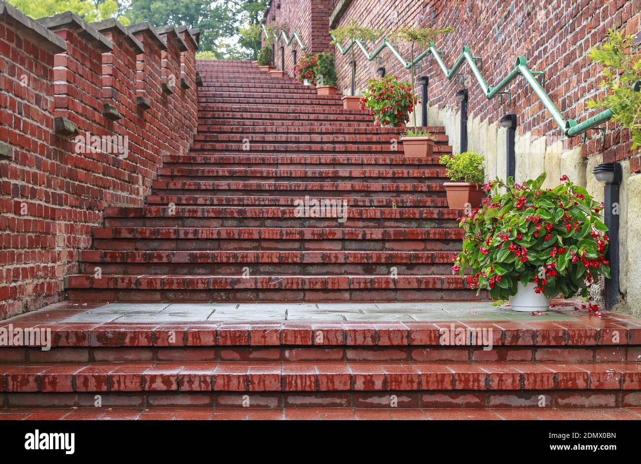 Wide brick stairs decorated with flowers. Summer time Stock Photo - Alamy