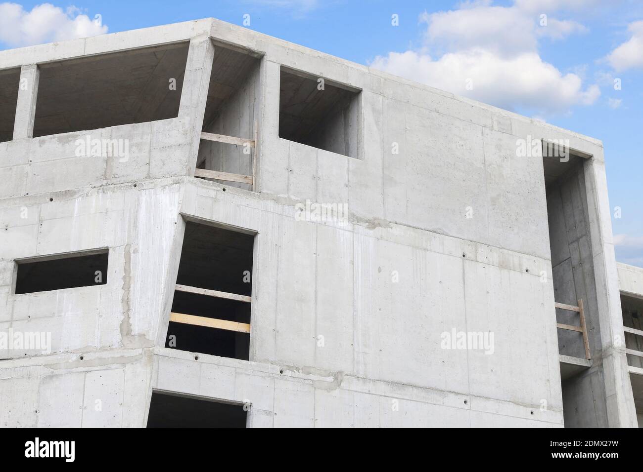 Unfinished abandoned concrete building. Modern architecture concept ...