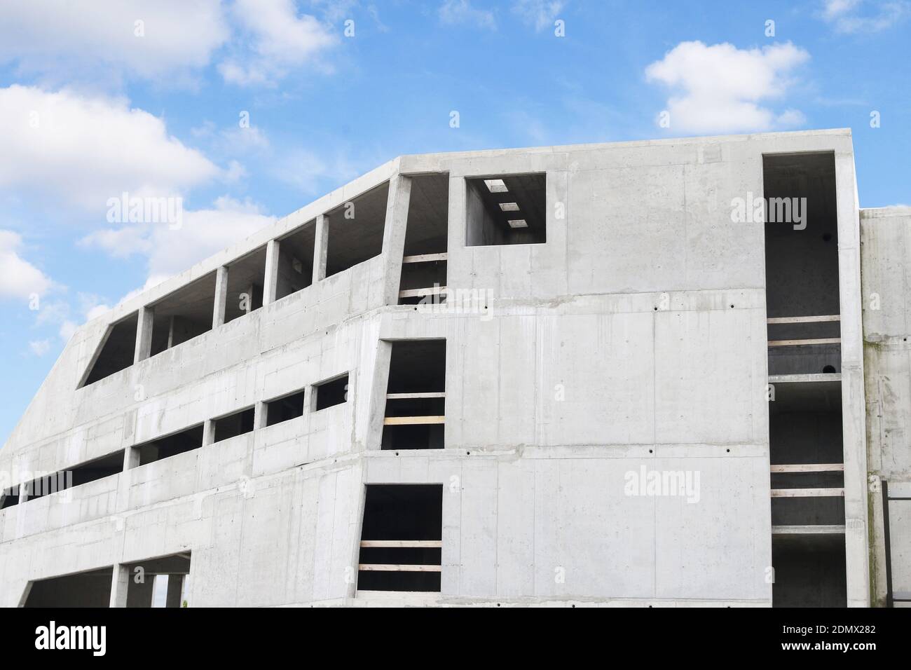 Unfinished abandoned concrete building. Modern architecture concept ...