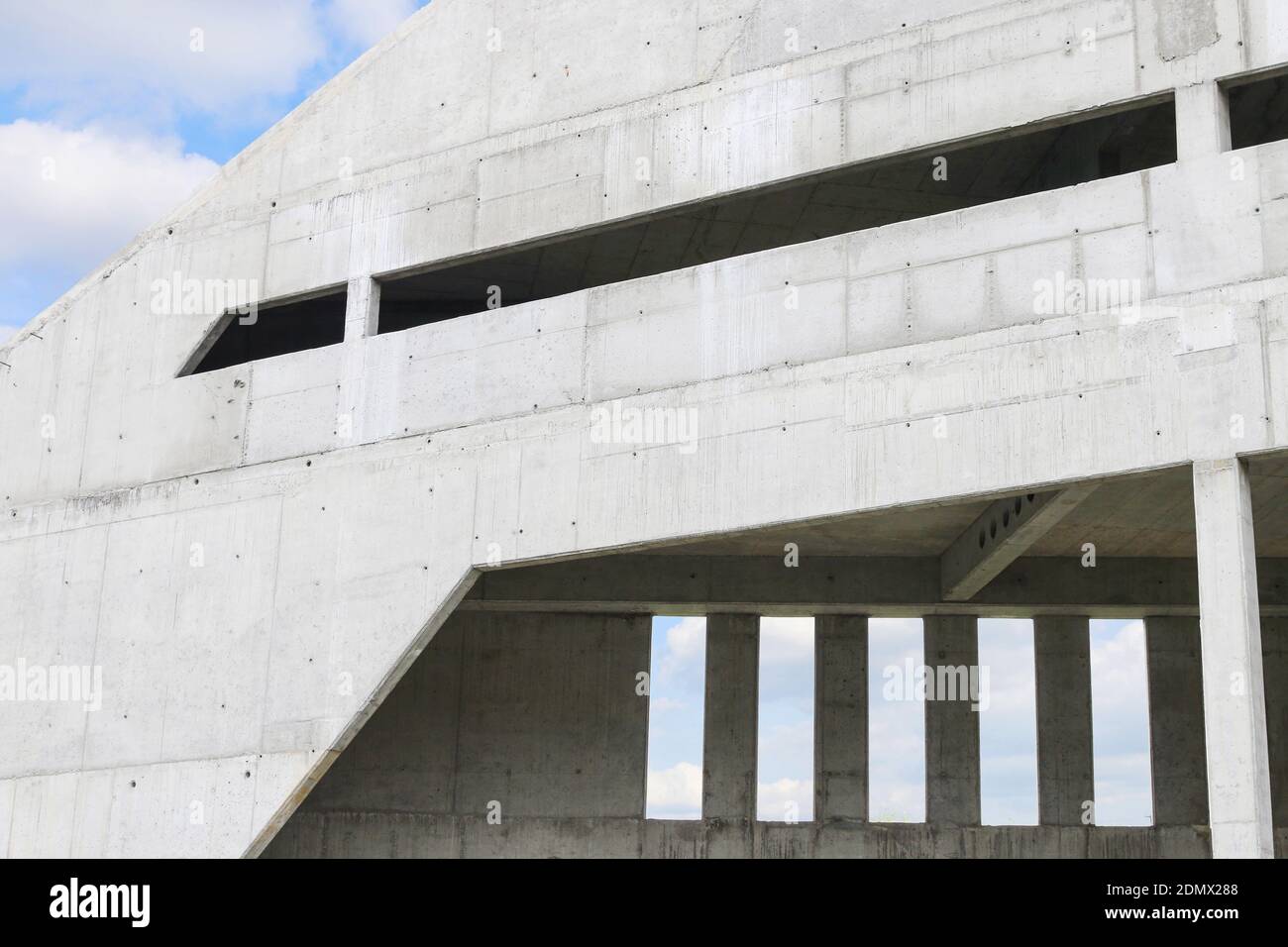 Unfinished abandoned concrete building. Modern architecture concept ...