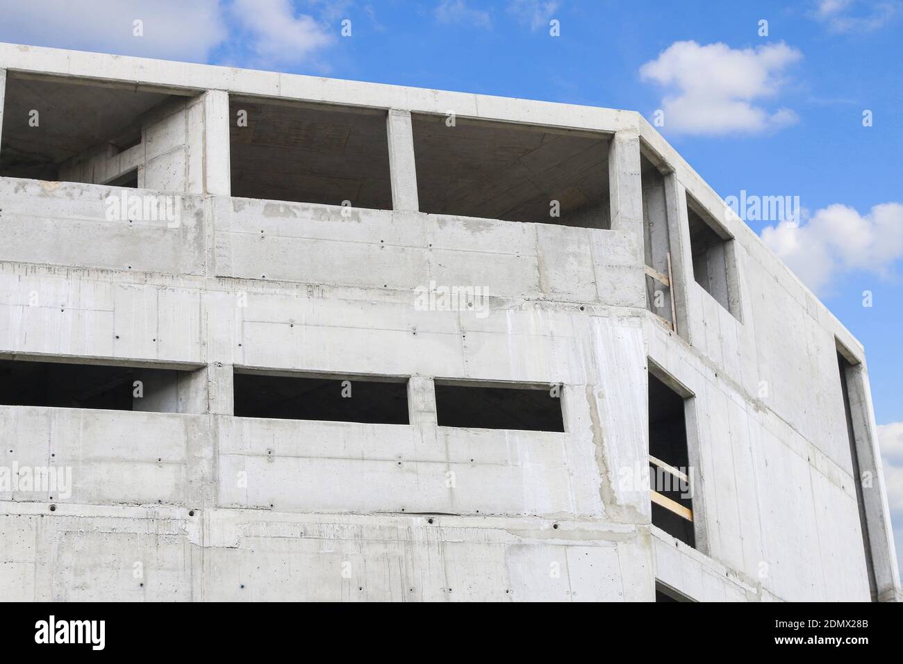 Unfinished abandoned concrete building. Modern architecture concept ...