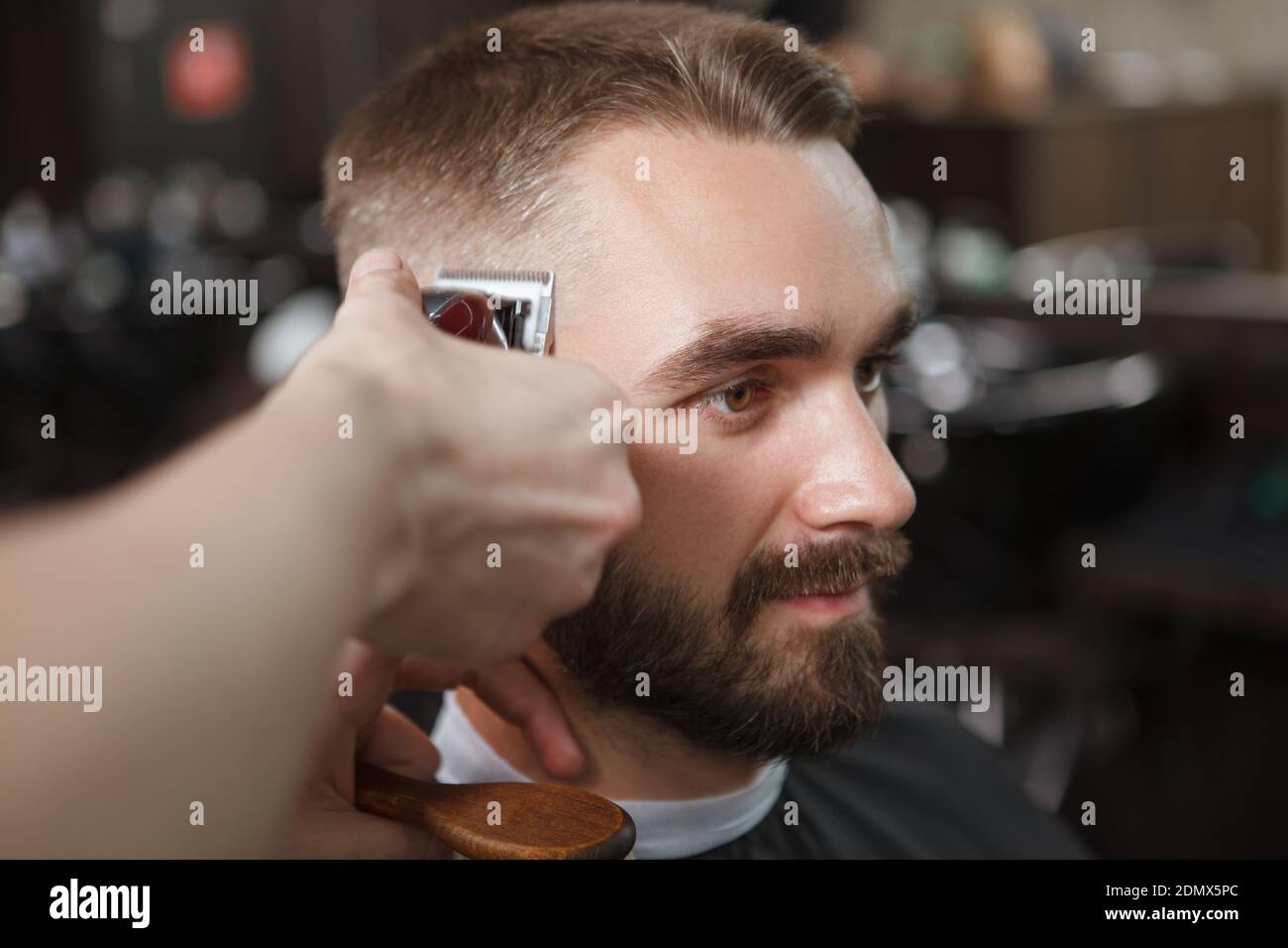 Handsome man getting new hairstyle hi-res stock photography and images ...