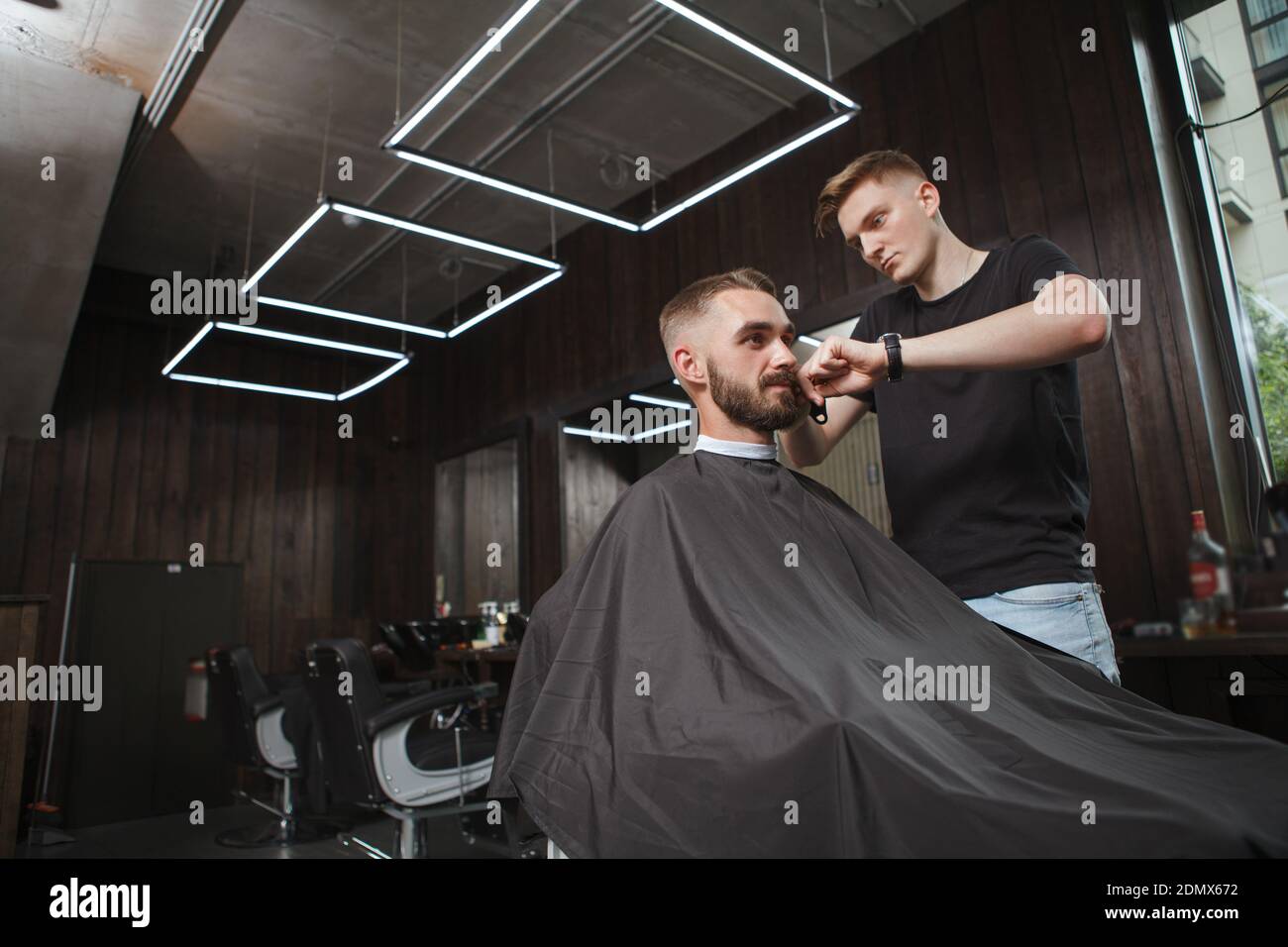 Handsome man getting new hairstyle hi-res stock photography and images ...