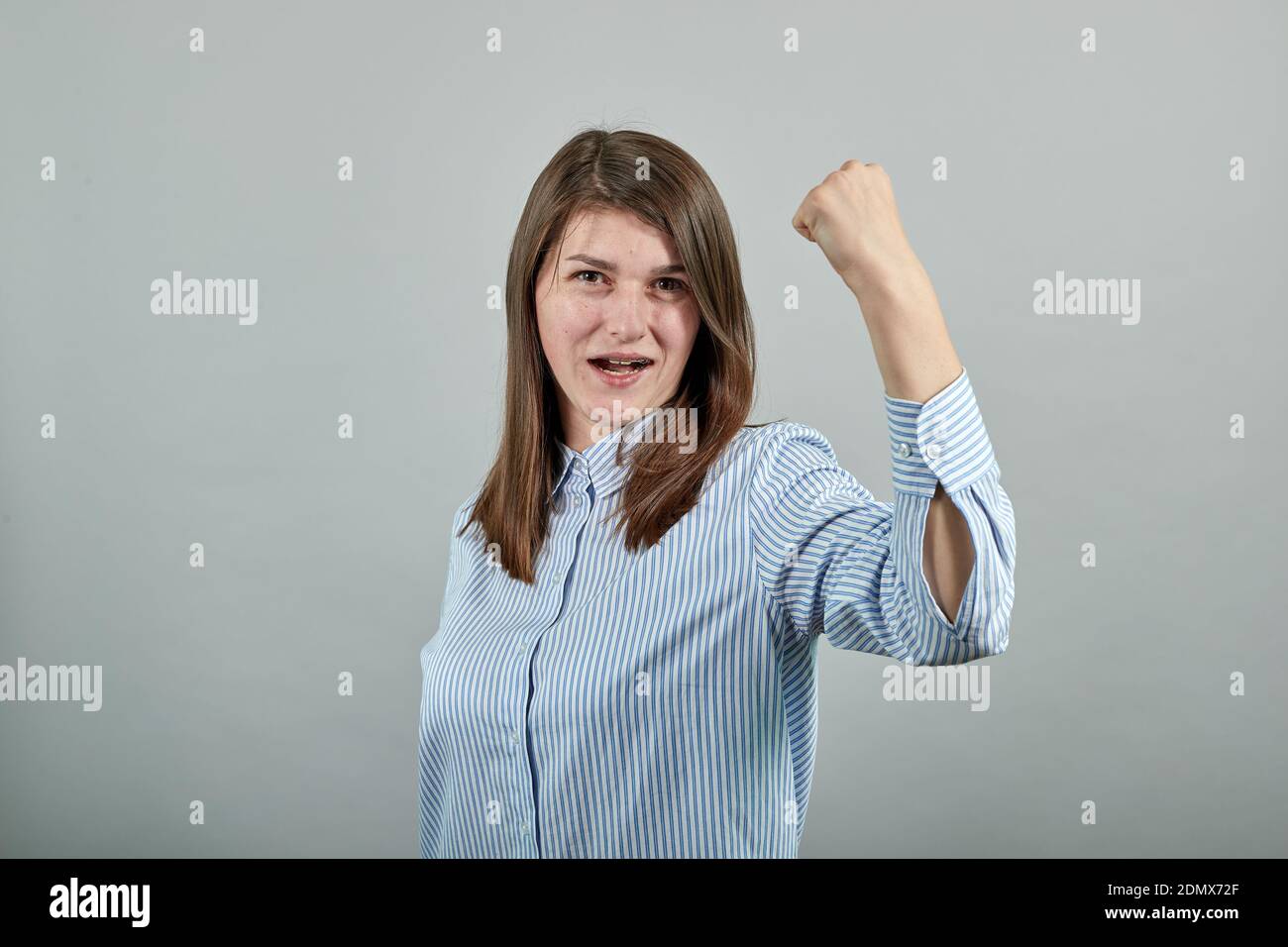 Angry and aggressive, shaking fist in a threatening way, domestic ...