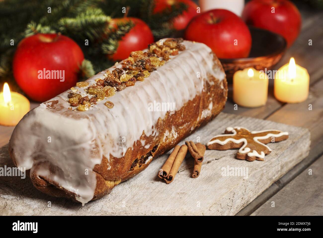 Christmas poppy seed cake and gingerbread cookie in bird shape. Candles ...