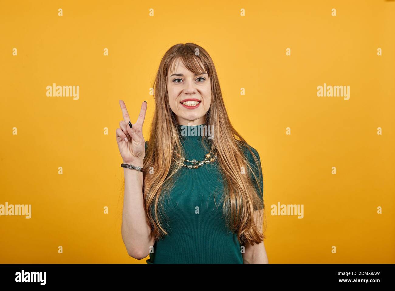 Woman 2 fingers up hi-res stock photography and images - Alamy