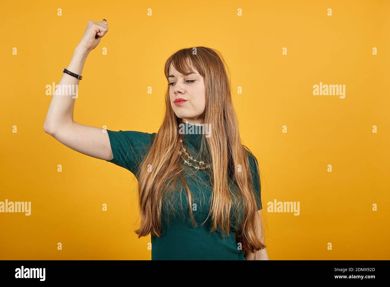 Feels proud have strength, shows great power, raises arms to show ...