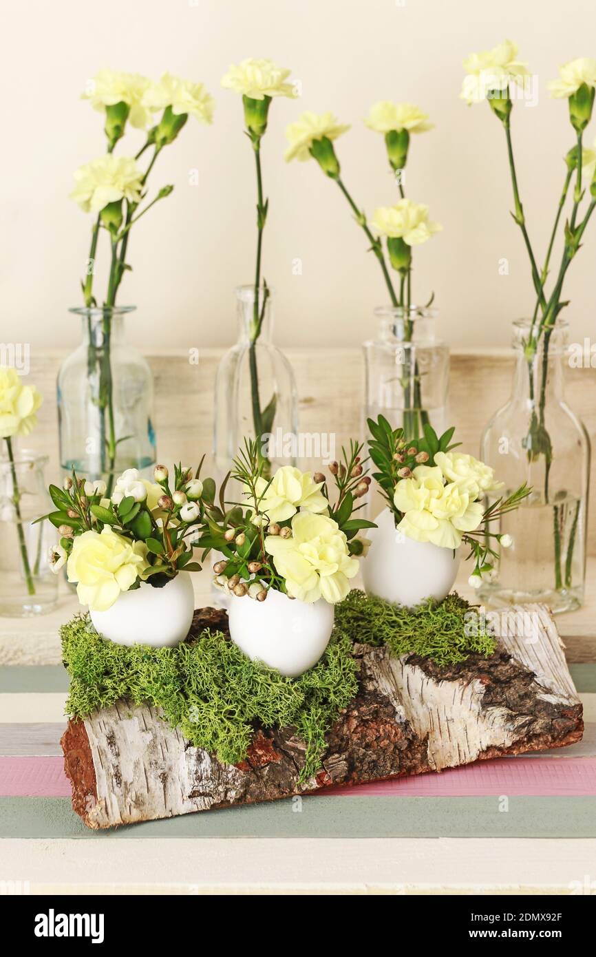 Easter decoration with egg shell, carnation flower, buxus, chamelaucium ...