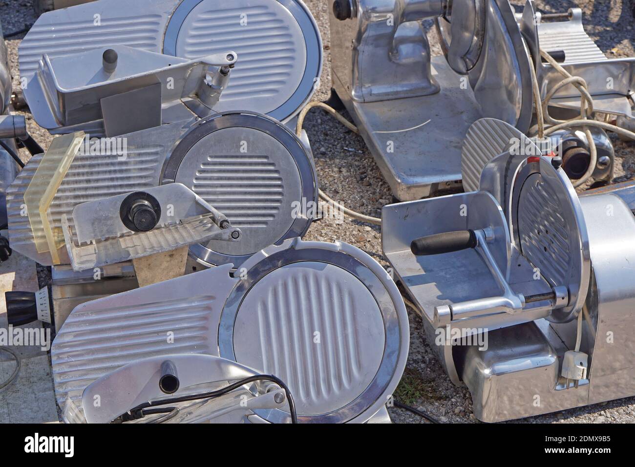 Many stainless steel meat slicers machines for deli Stock Photo - Alamy