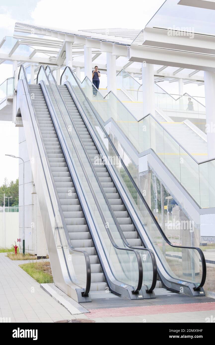 Modern escalator in city center of Krakow, Poland Stock Photo - Alamy