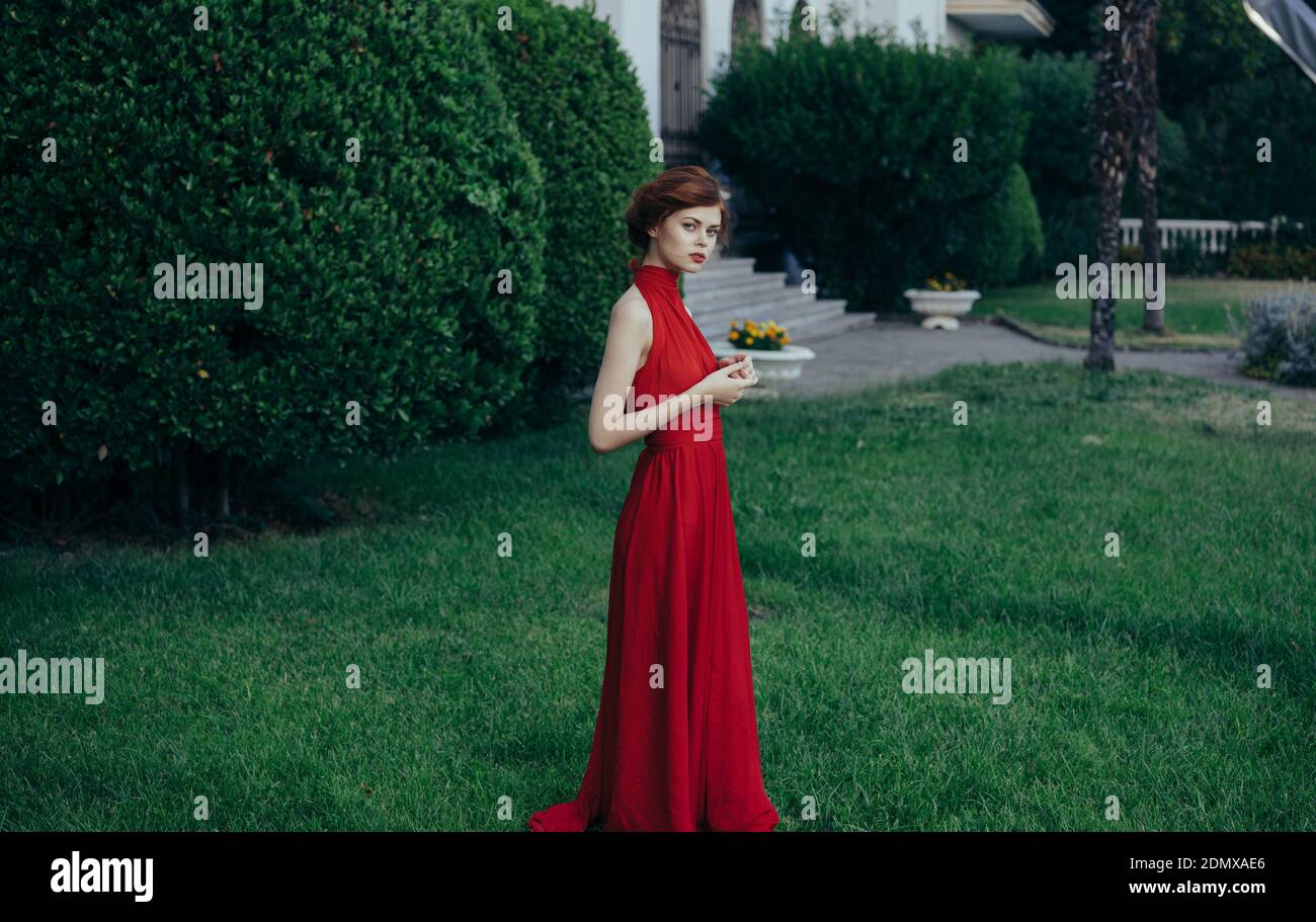 Woman in red dress with electrical insoles Medieval masquerade ...