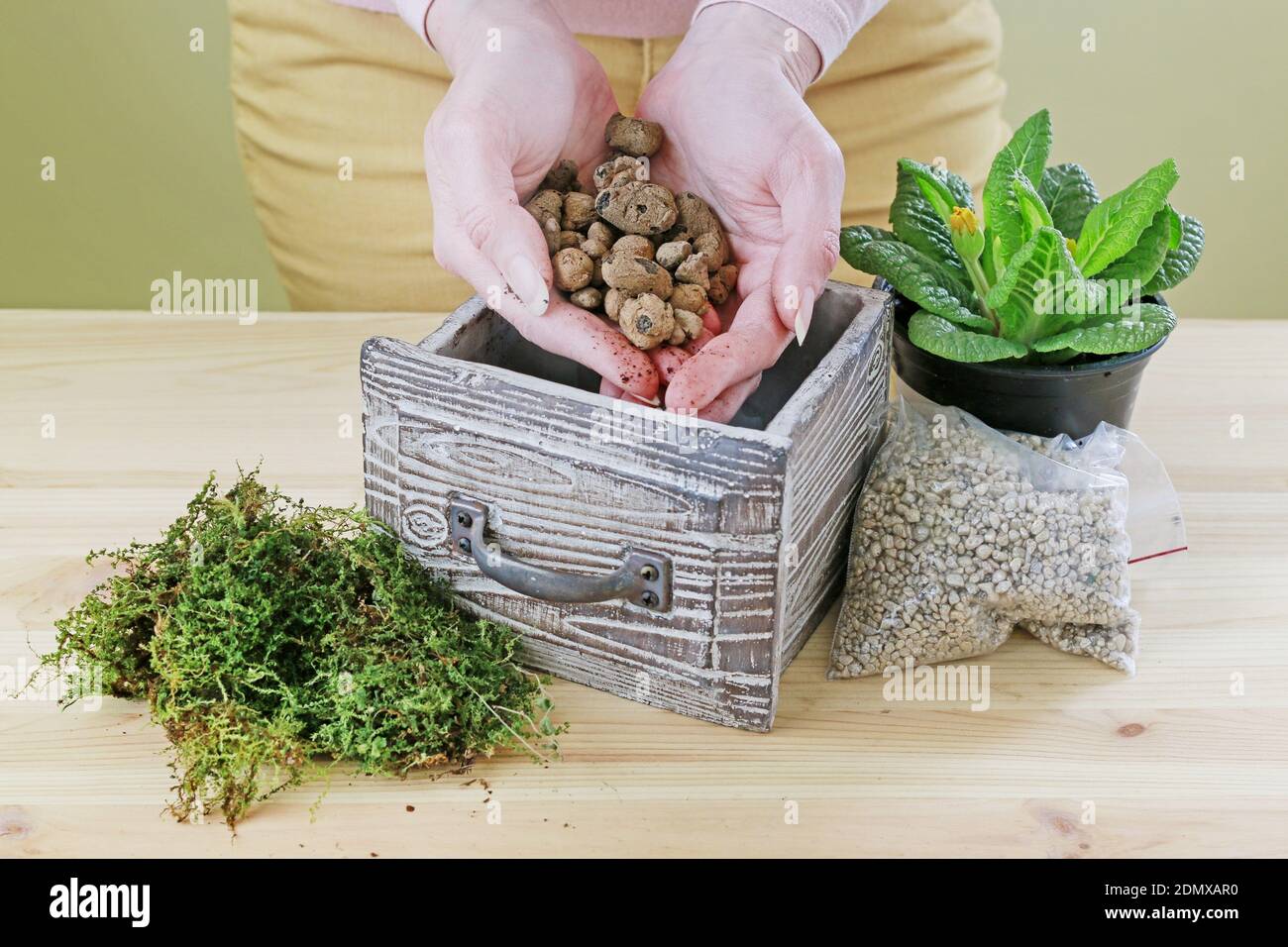 Florist at work: woman shows how to make a simple decoration with ...