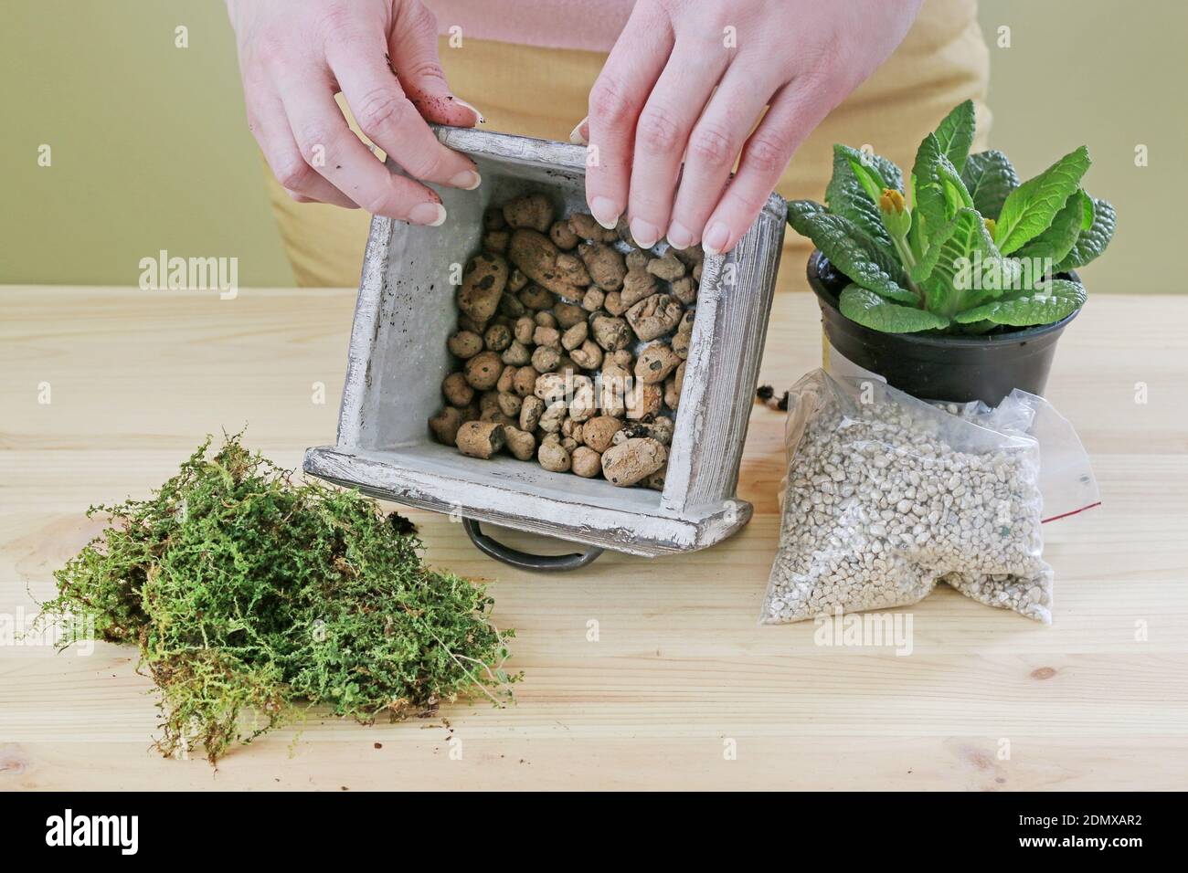 Florist at work: woman shows how to make a simple decoration with ...
