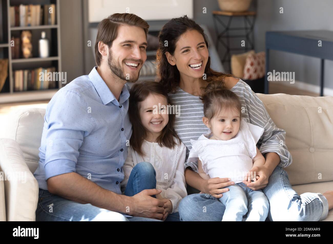 Overjoyed family with kids relax on sofa at home Stock Photo - Alamy