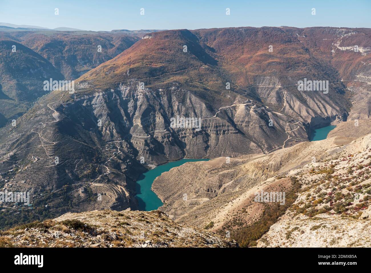 Wonderful green valley with large mountains covered with forest and ...