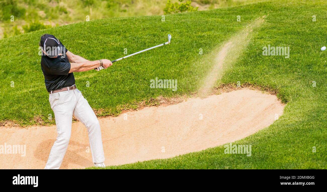 A middle-aged sportsman playing golf in the golf ground Stock Photo - Alamy