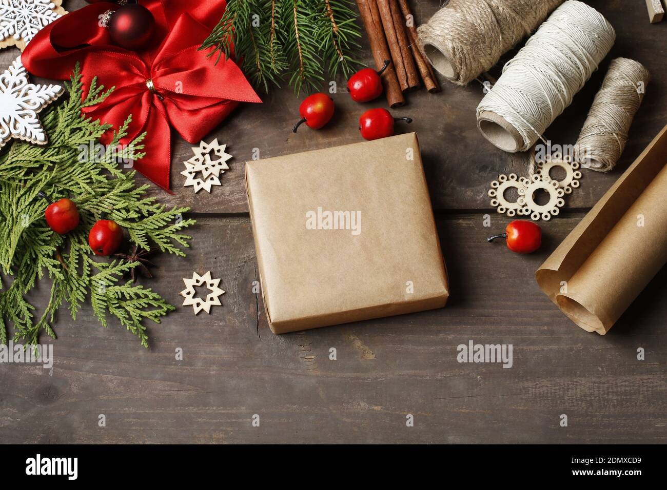 Woman shows how to beautifully pack Christmas presents. Step by step ...