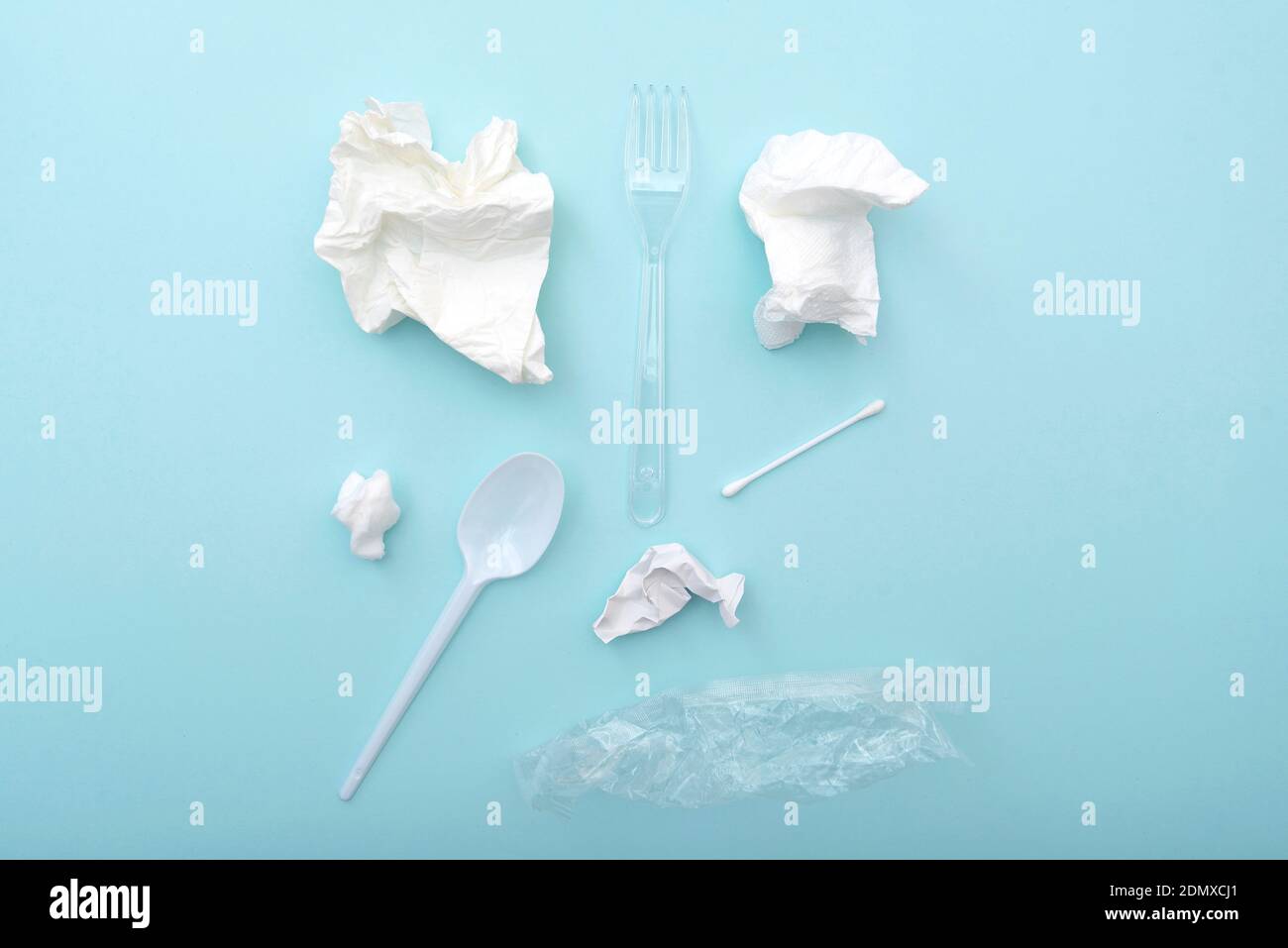 Used plastic dishes as garbage, crumpled paper napkins, cotton buds ...