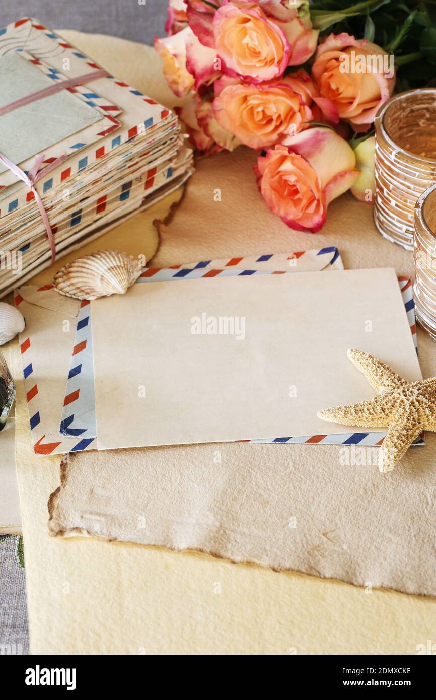 Vintage letters, paper cards and flowers on the table. Romantic ...