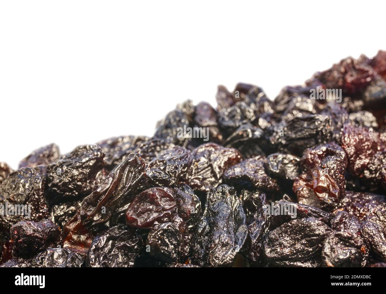 Extreme close up picture of small seedless raisins isolated on white ...