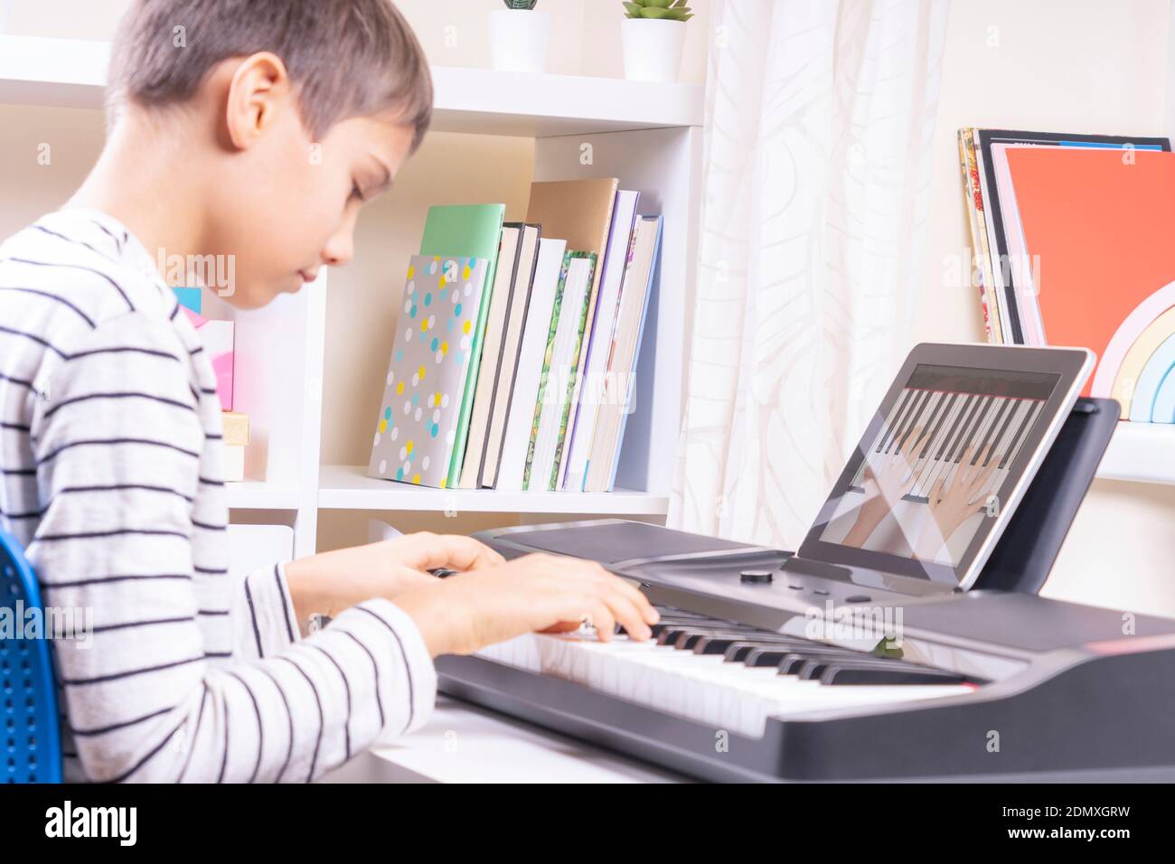 Online learning, remote education. Teenage boy watching video tutorial ...