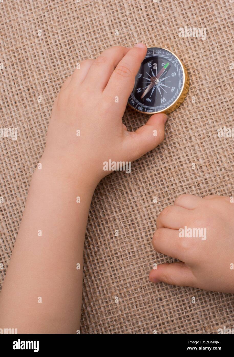 Child holding compass hi-res stock photography and images - Alamy