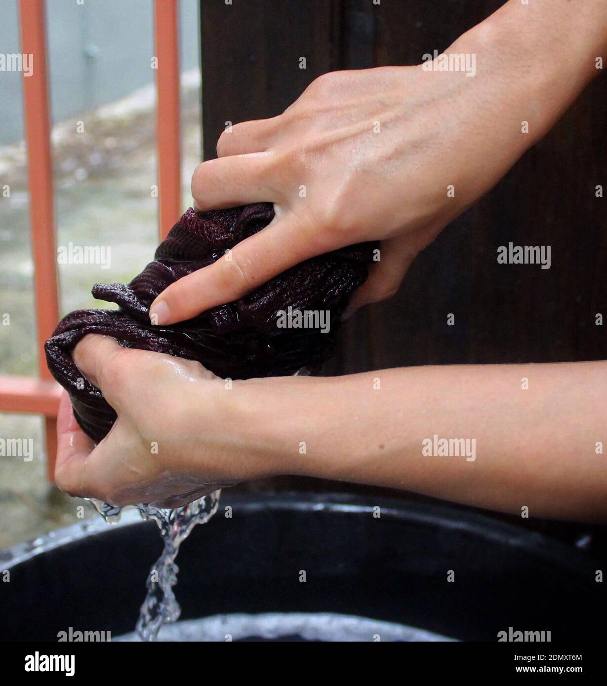 Squeezing clothes hi-res stock photography and images - Alamy