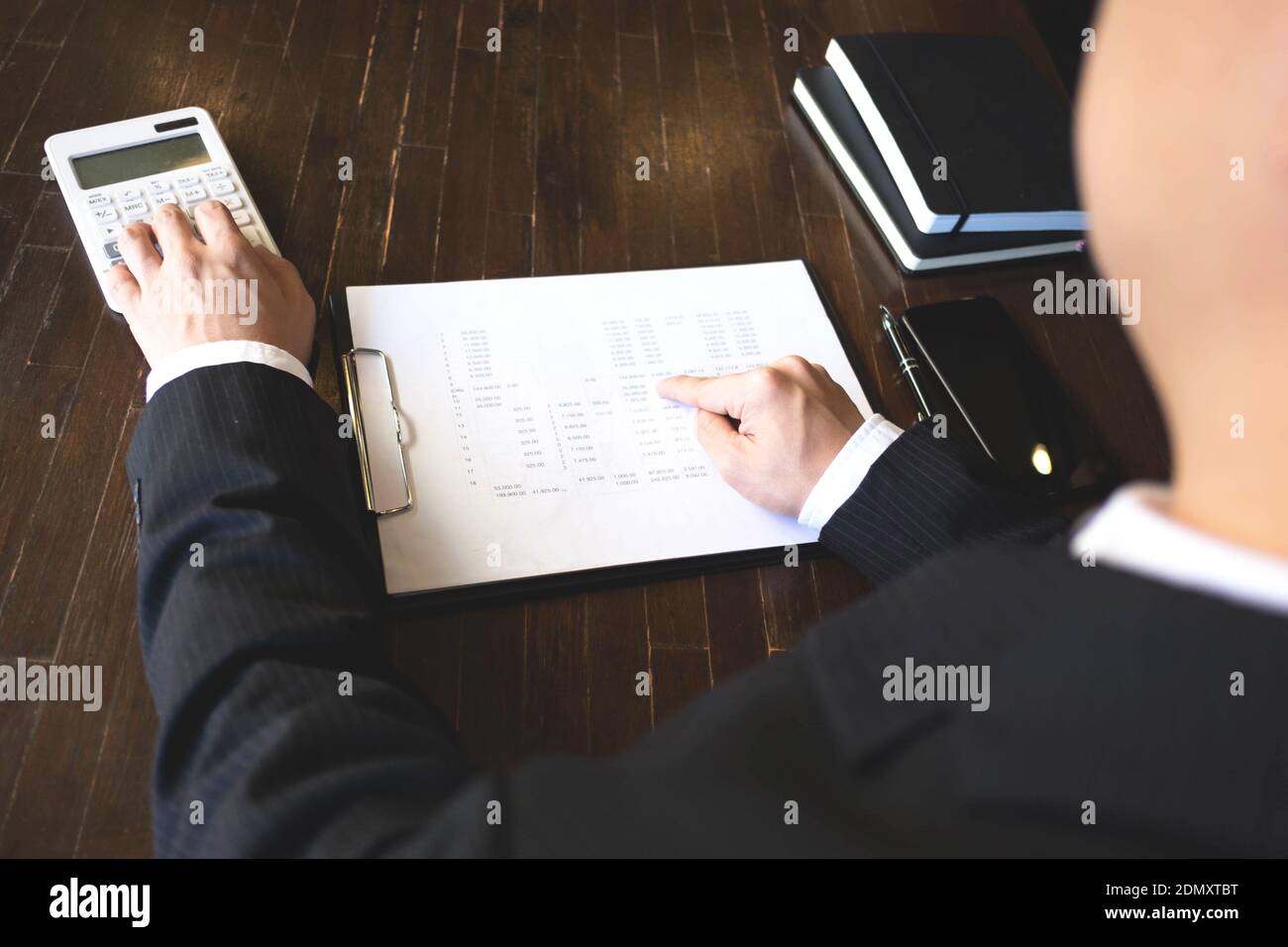Calculating figures hi-res stock photography and images - Alamy