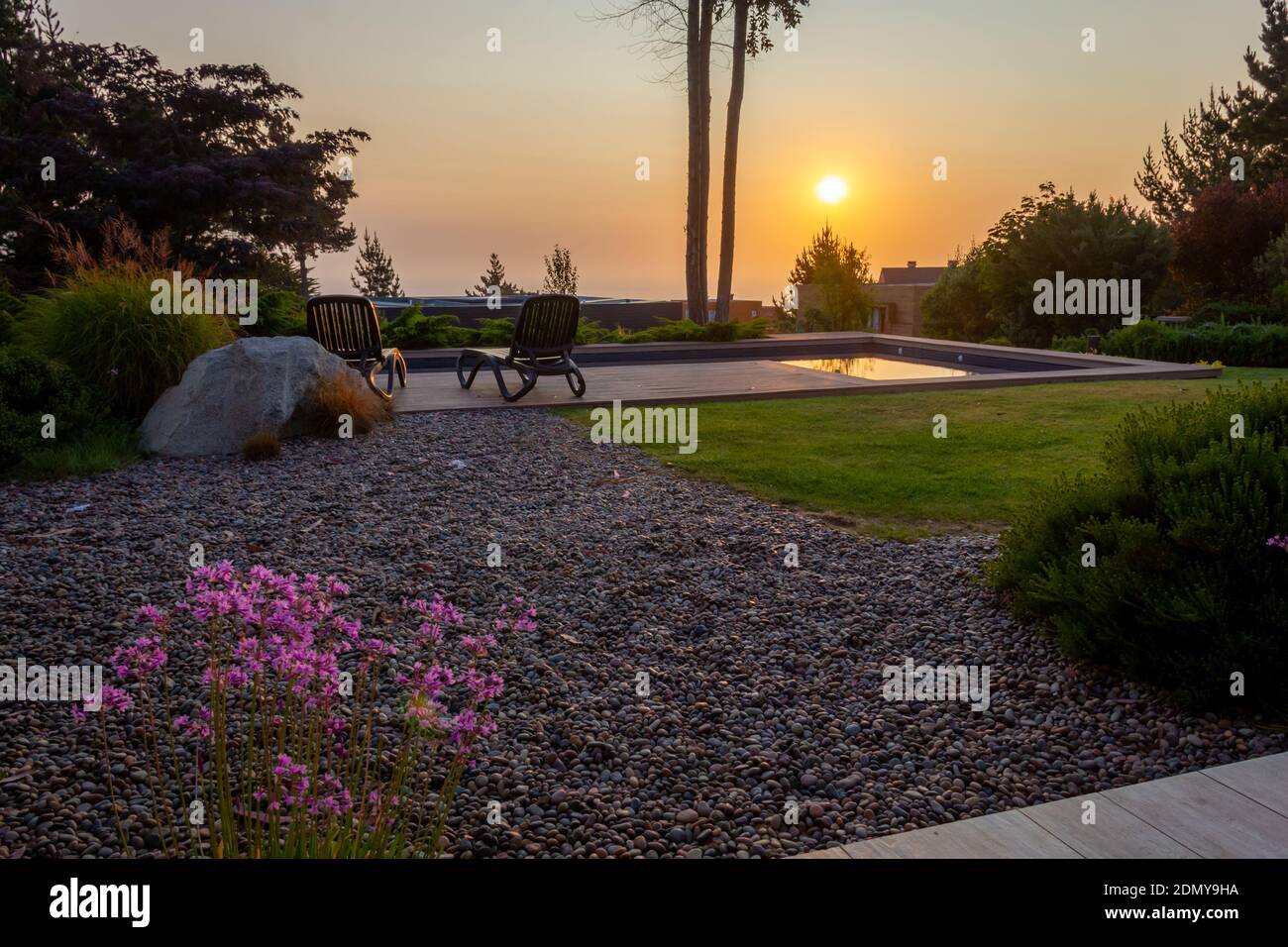 Sunset views from backyard with hammocks by swimming pool. Great ...