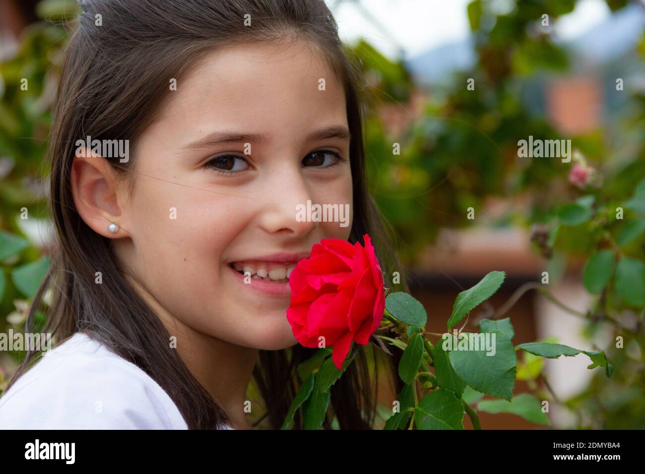 Little child smelling rose hi-res stock photography and images - Alamy