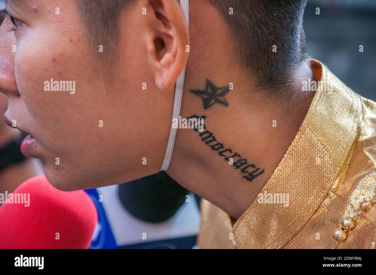 Jatuporn Sae-Eung is seen having a tattoo reading democracy on her neck ...