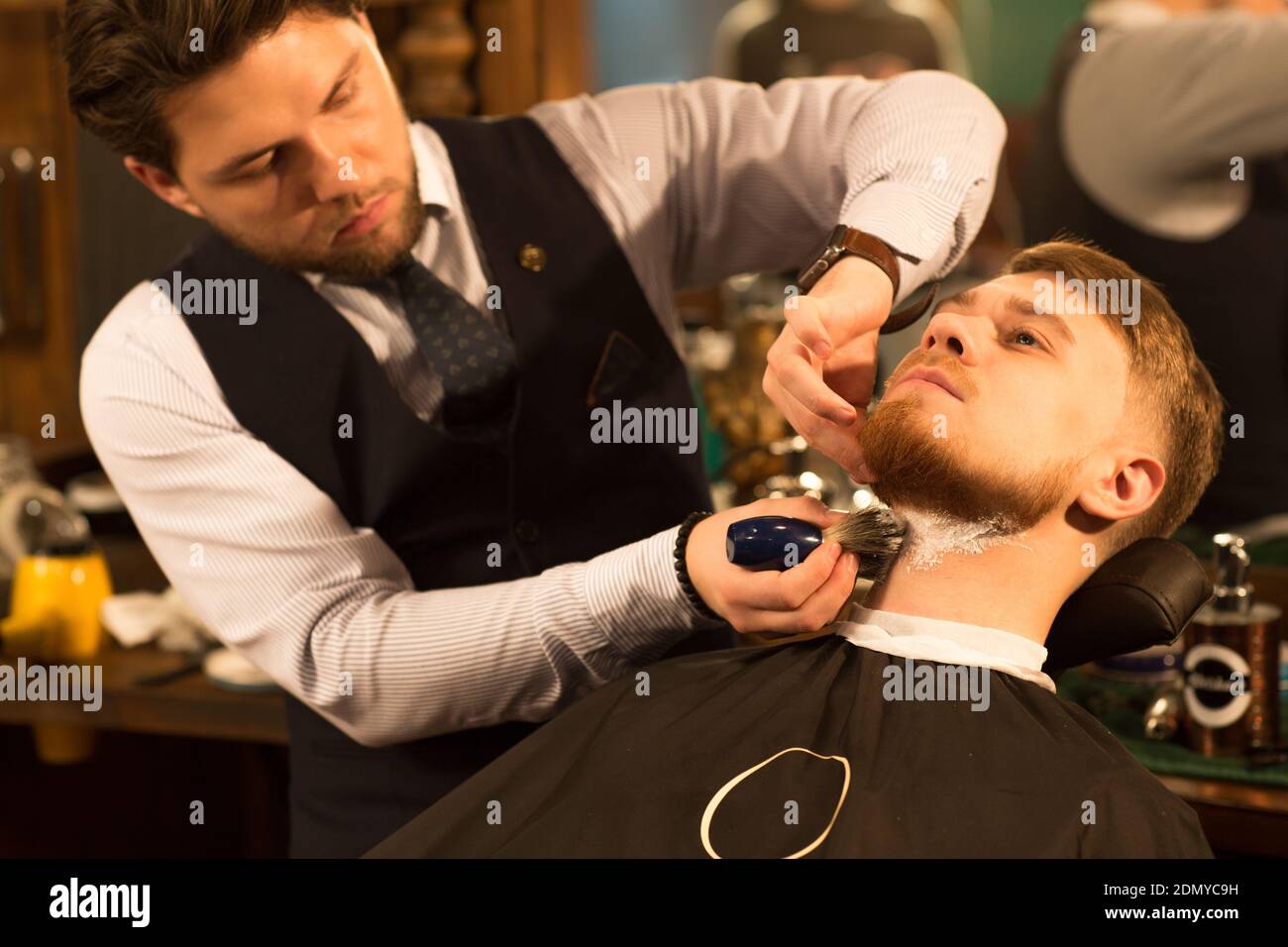 Man being shaved hi-res stock photography and images - Alamy