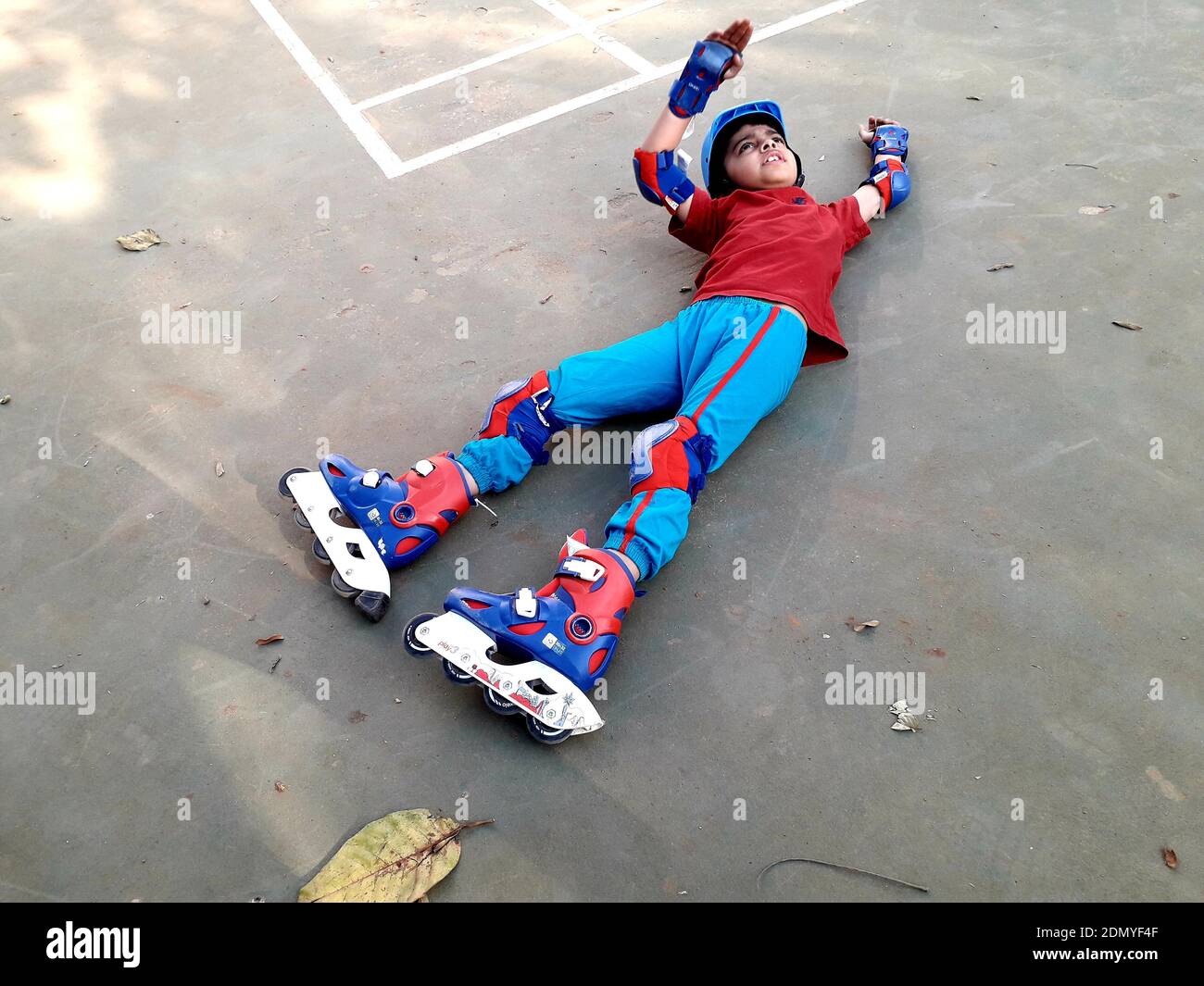 Boy inline skating outdoors hi-res stock photography and images - Alamy