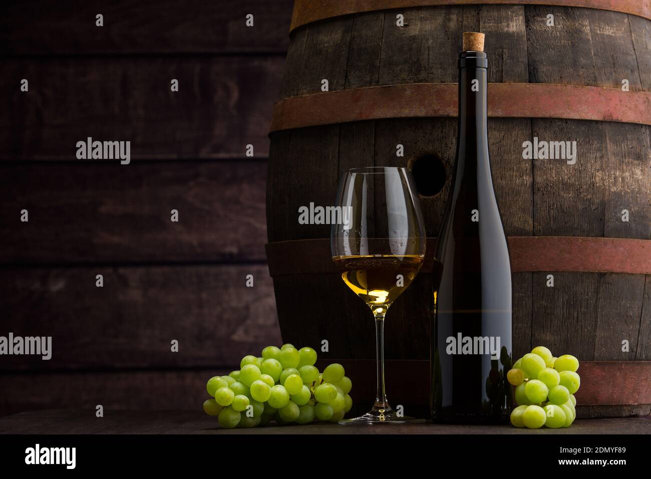 white wine bottle and wine glass on wodden barrel Stock Photo - Alamy