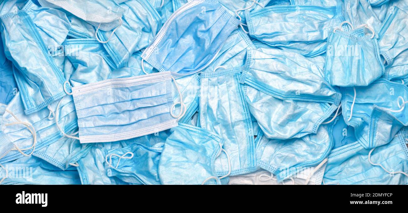 Used mask background. Disposal Coronavirus. Trash mask. Covid-19 waste ...