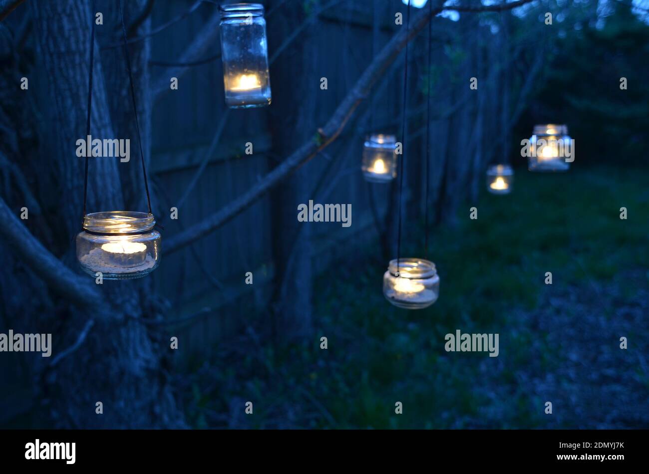 Candle hanging in tree outdoors hi-res stock photography and images - Alamy