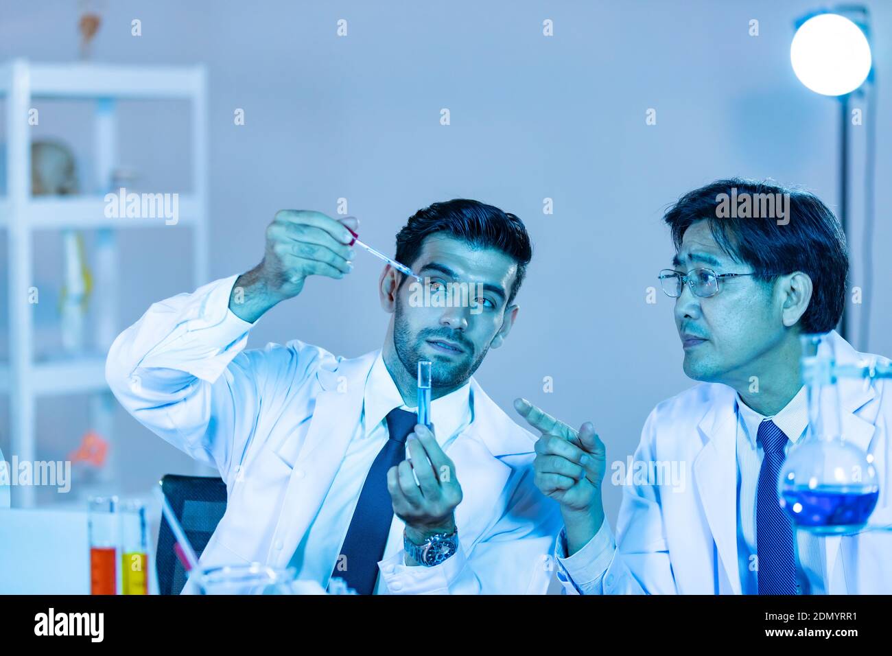 Team of research scientists analysing test trial new generation vaccine ...