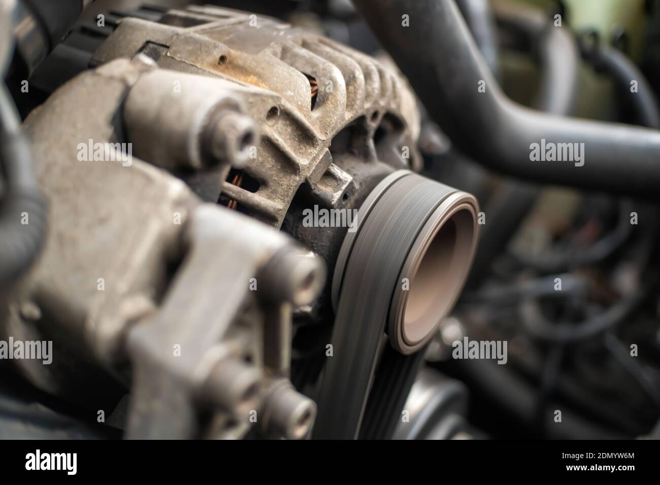 AC generator for a car close-up, the engine compartment of a passenger ...