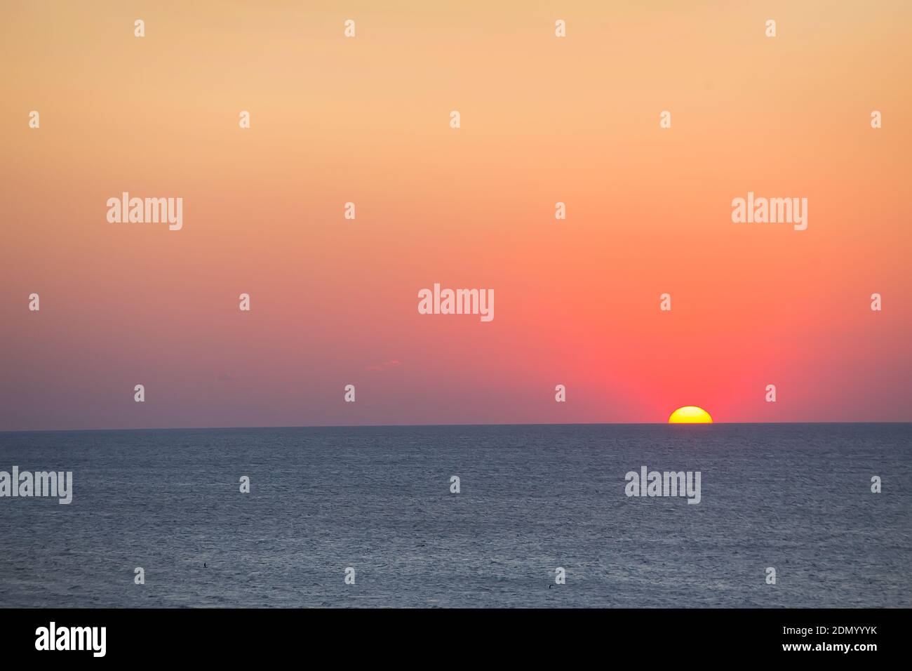 Sunset at sea. Orange, red and violet sky Stock Photo - Alamy