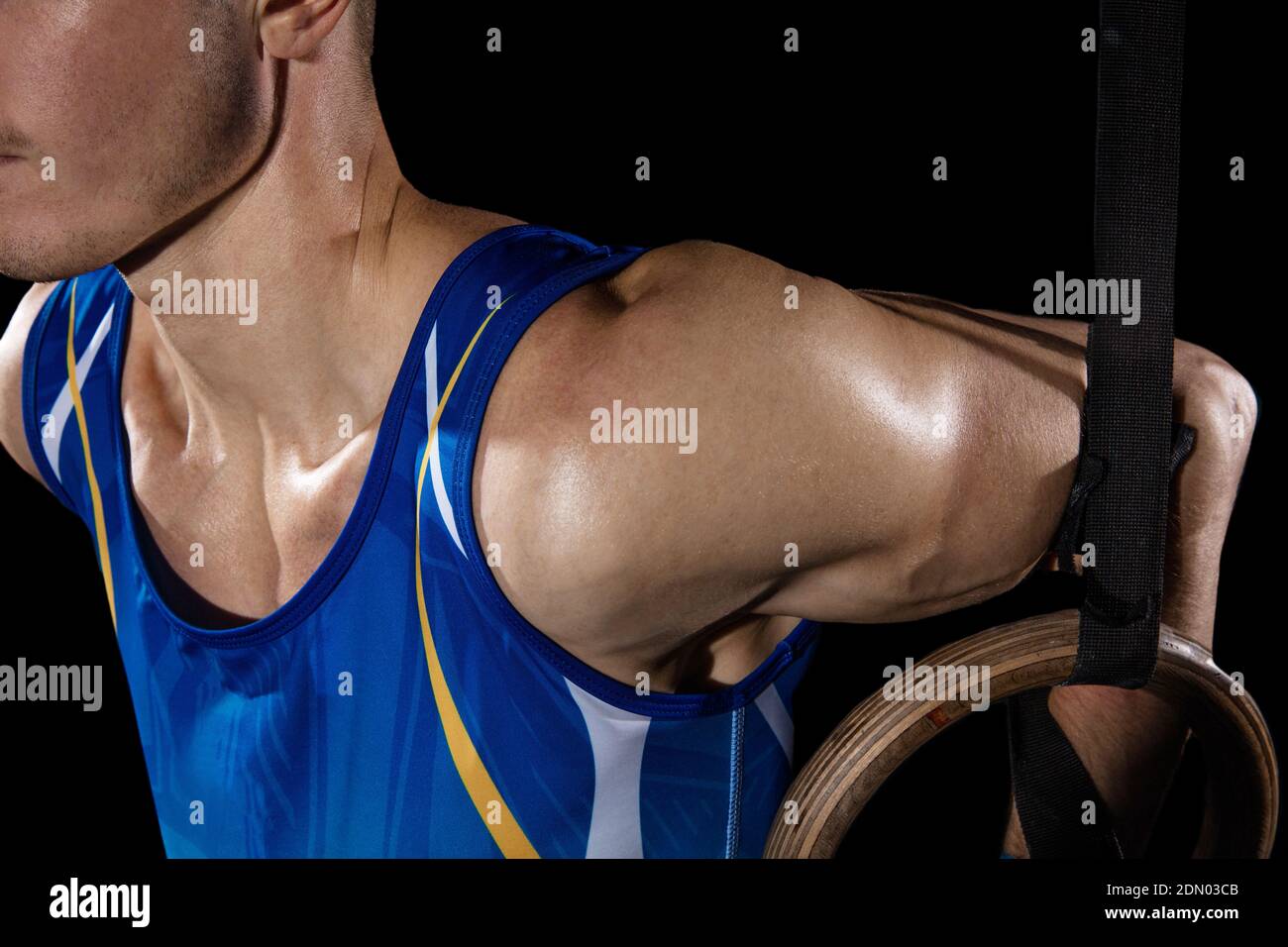 Close up. Muscular male gymnast training in gym, flexible and active ...