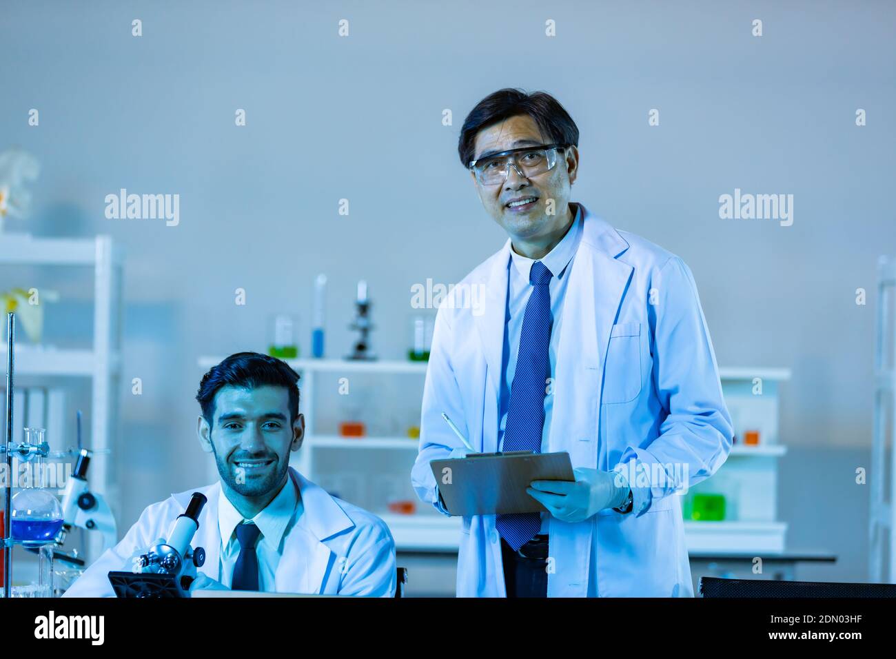 Team of research scientists analysing test trial new generation vaccine ...