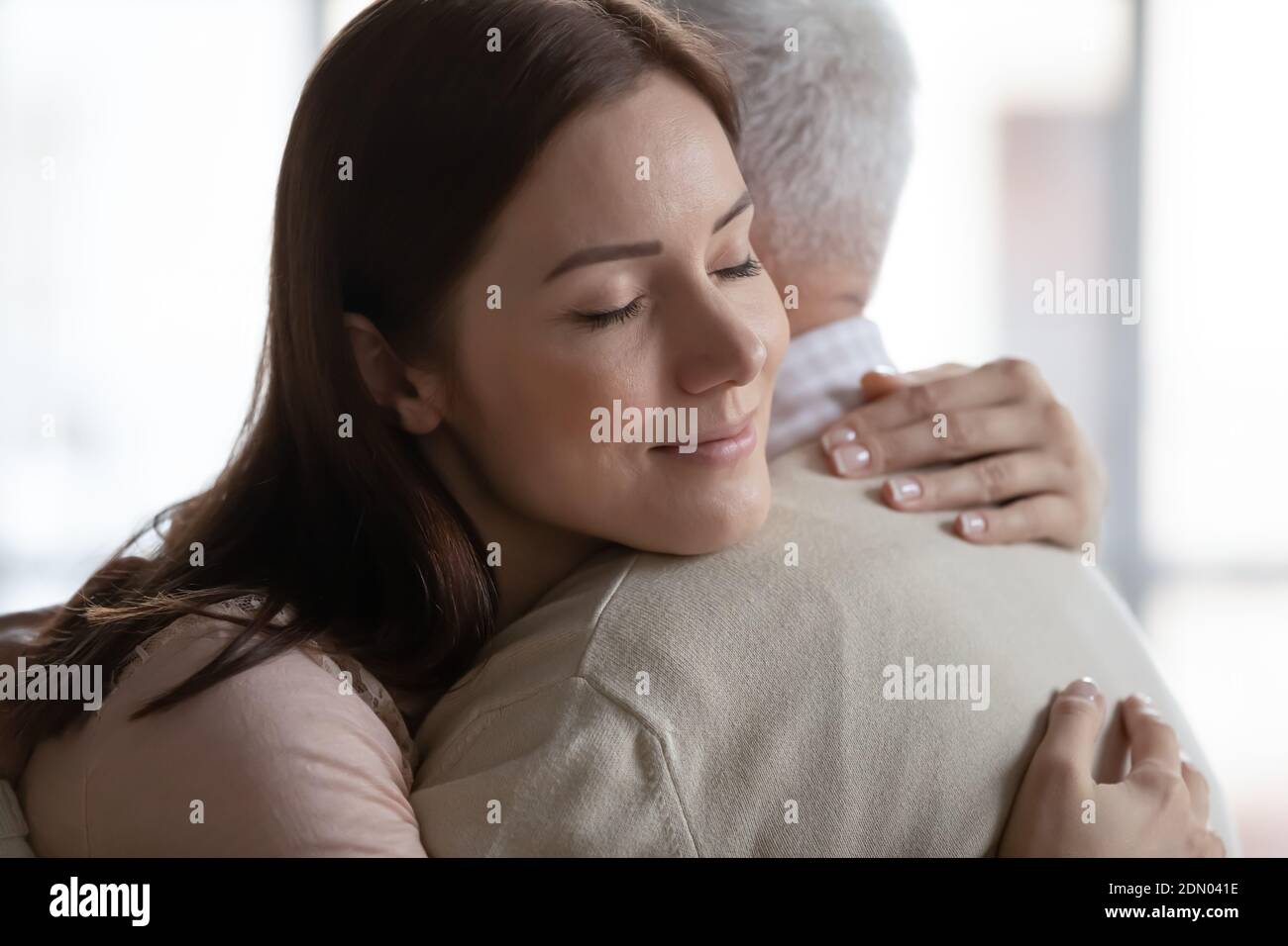 Old woman hug child hi-res stock photography and images - Alamy