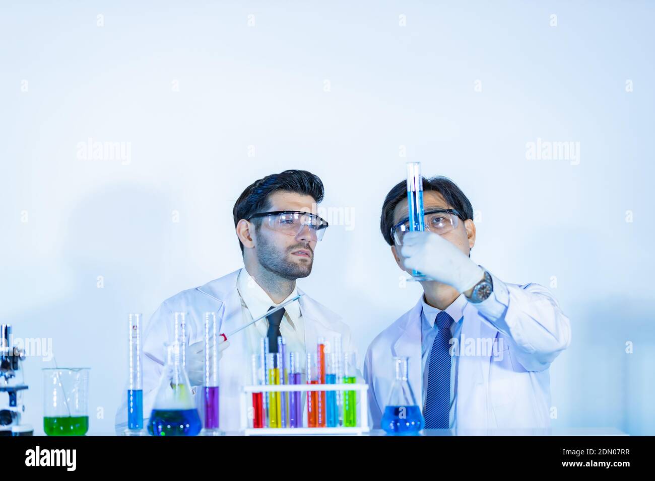 Team of research scientists analysing test trial new generation vaccine ...