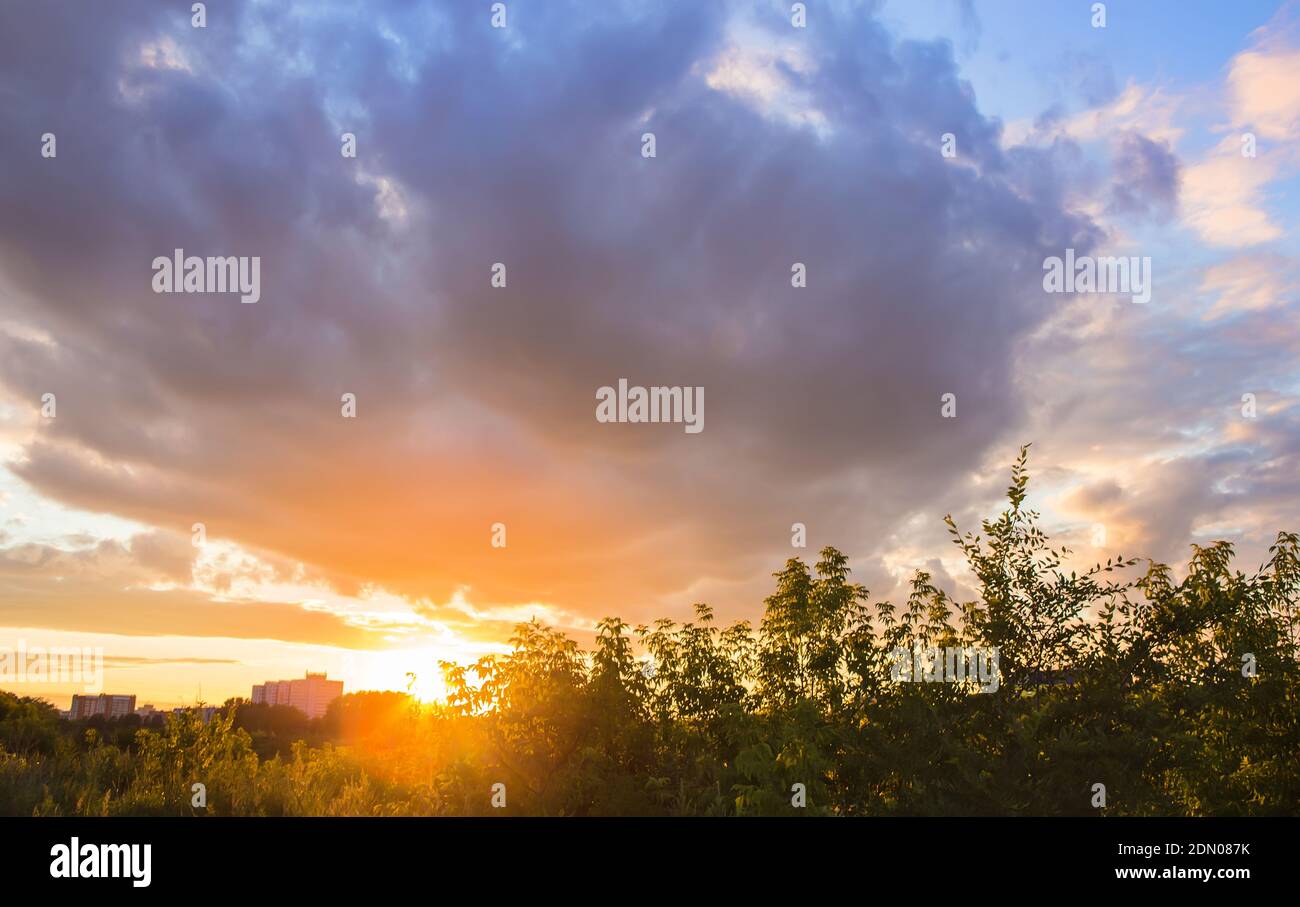 beautiful sunset sky over the buildings in the city Stock Photo - Alamy