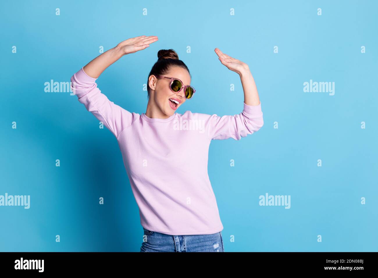 Photo of positive cheerful excited girl enjoy rejoice dance raise hands ...