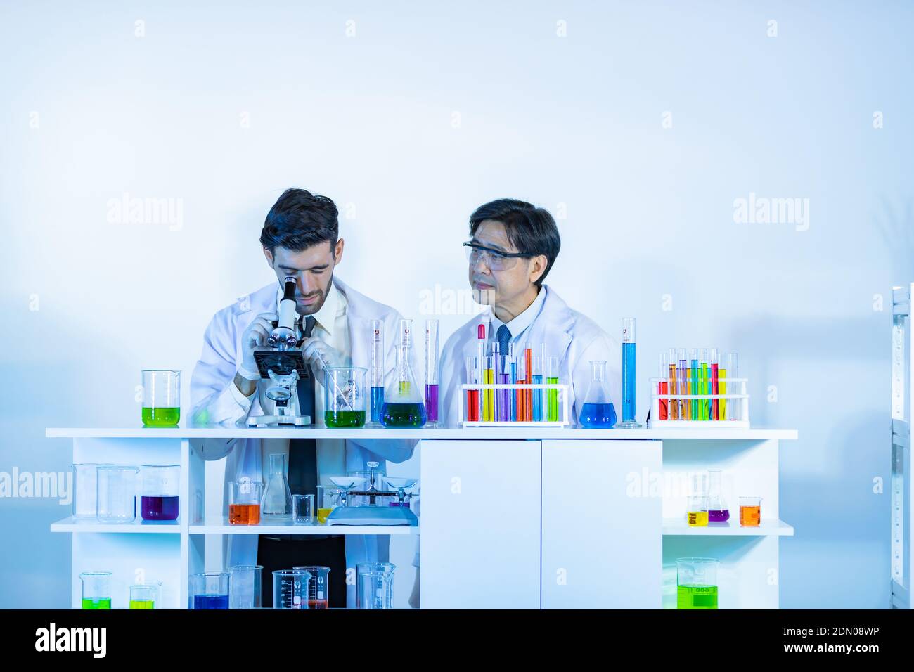 Team of research scientists analysing test trial new generation vaccine ...